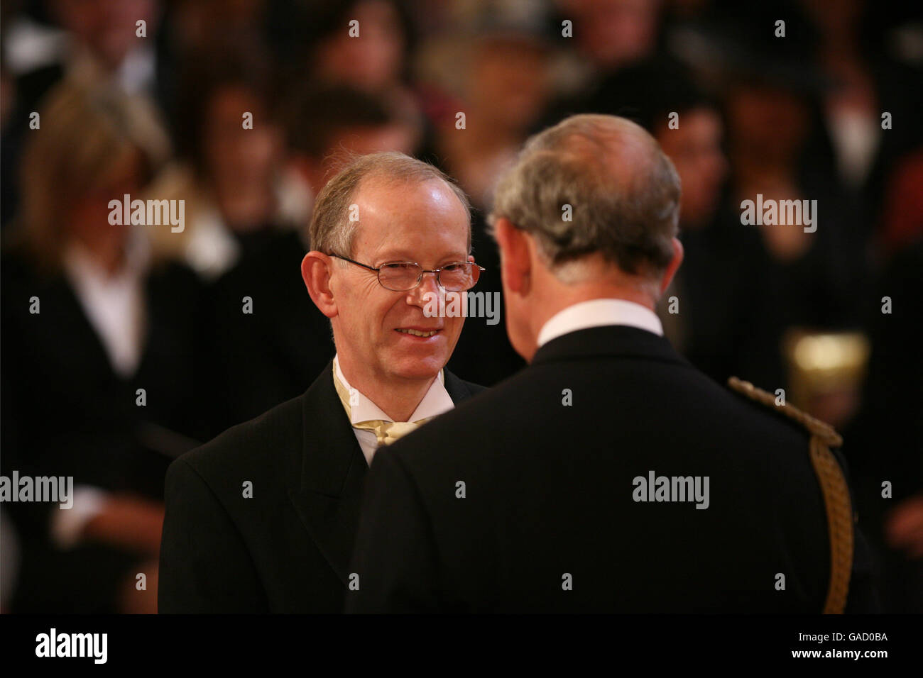 Dr. Malcolm Wakerley from Epsom is made an OBE by the Prince of Wales ...