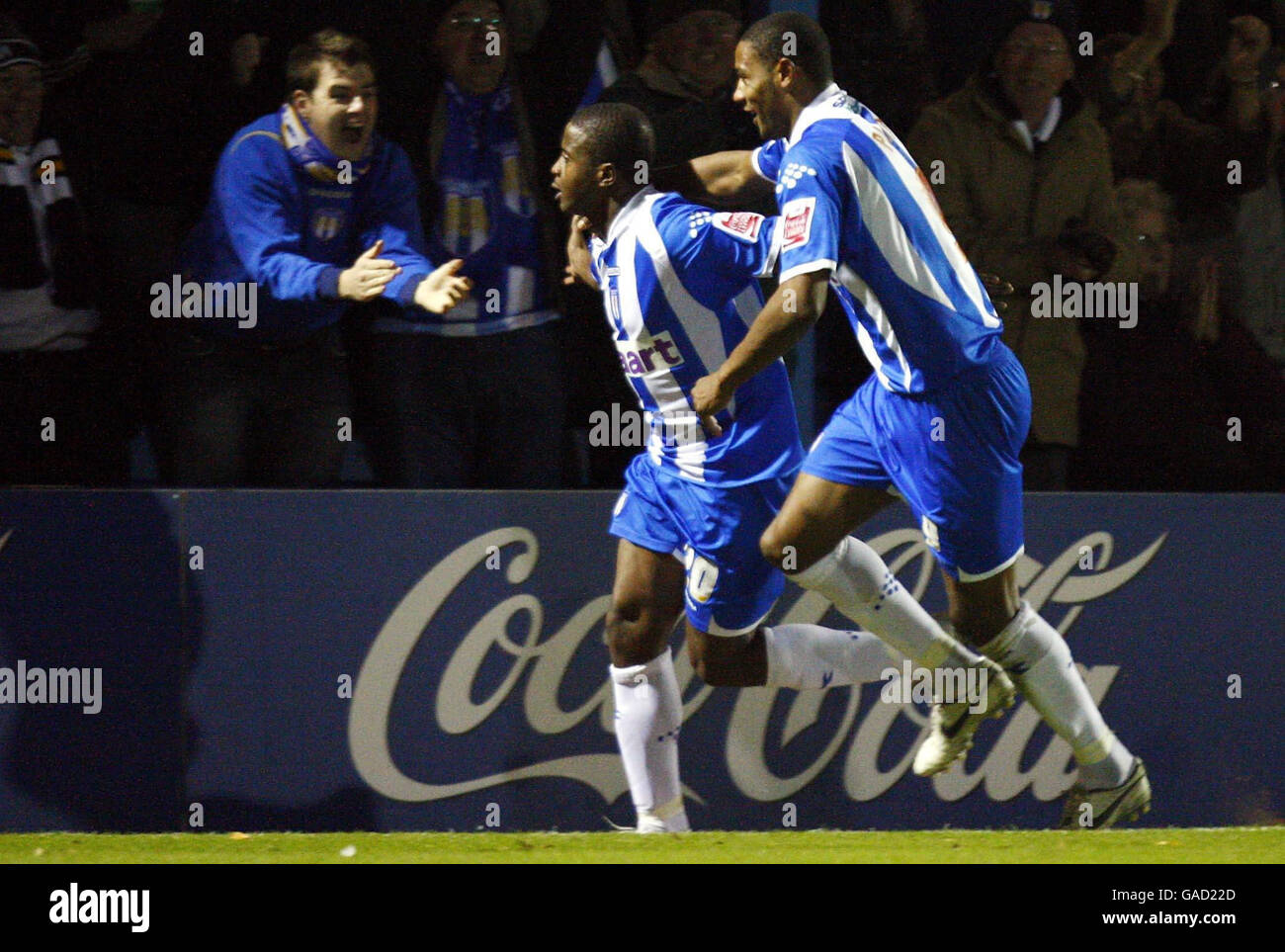 Colchester's Kevin Lisbie celebrates his goal with team mate Clive ...