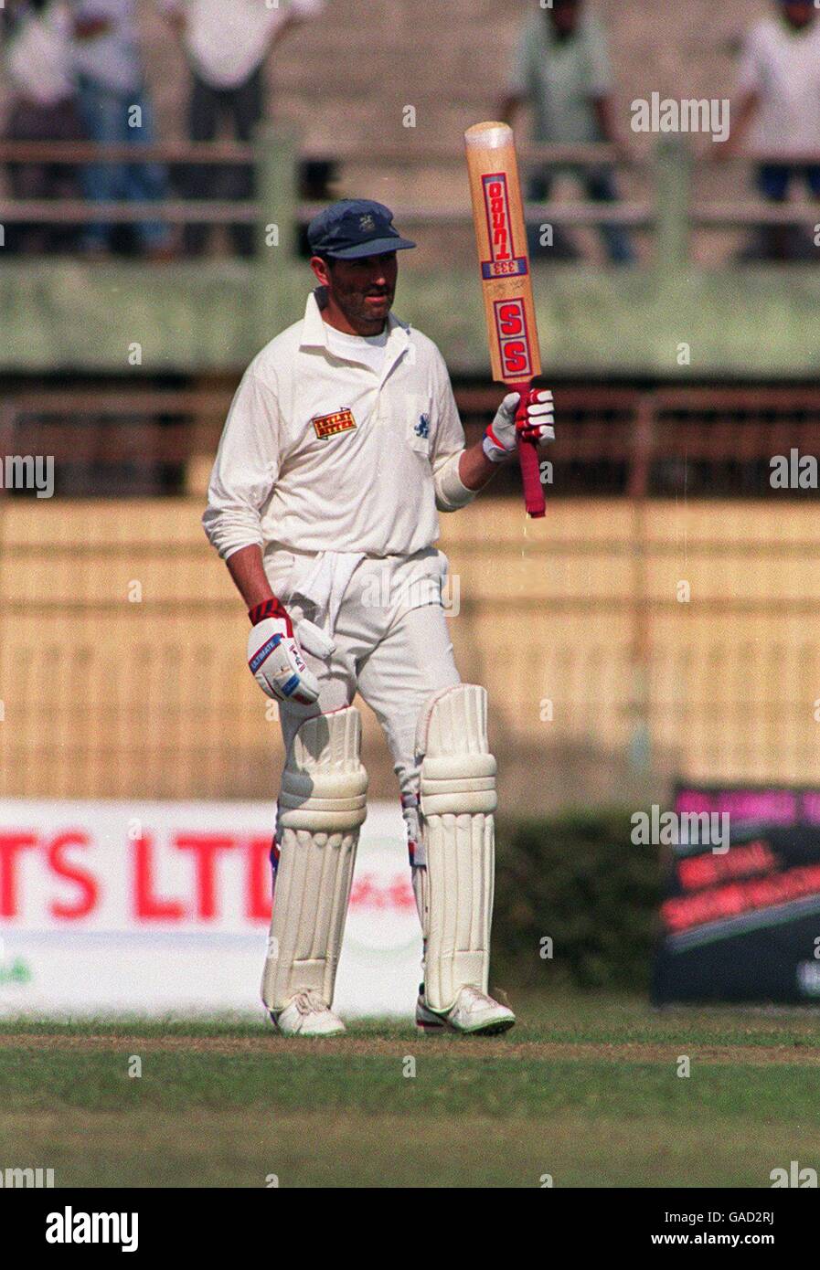 CRICKET TOUR OF INDIA. ENGLAND'S GRAHAM GOOCH RAISES HIS BAT TO ...