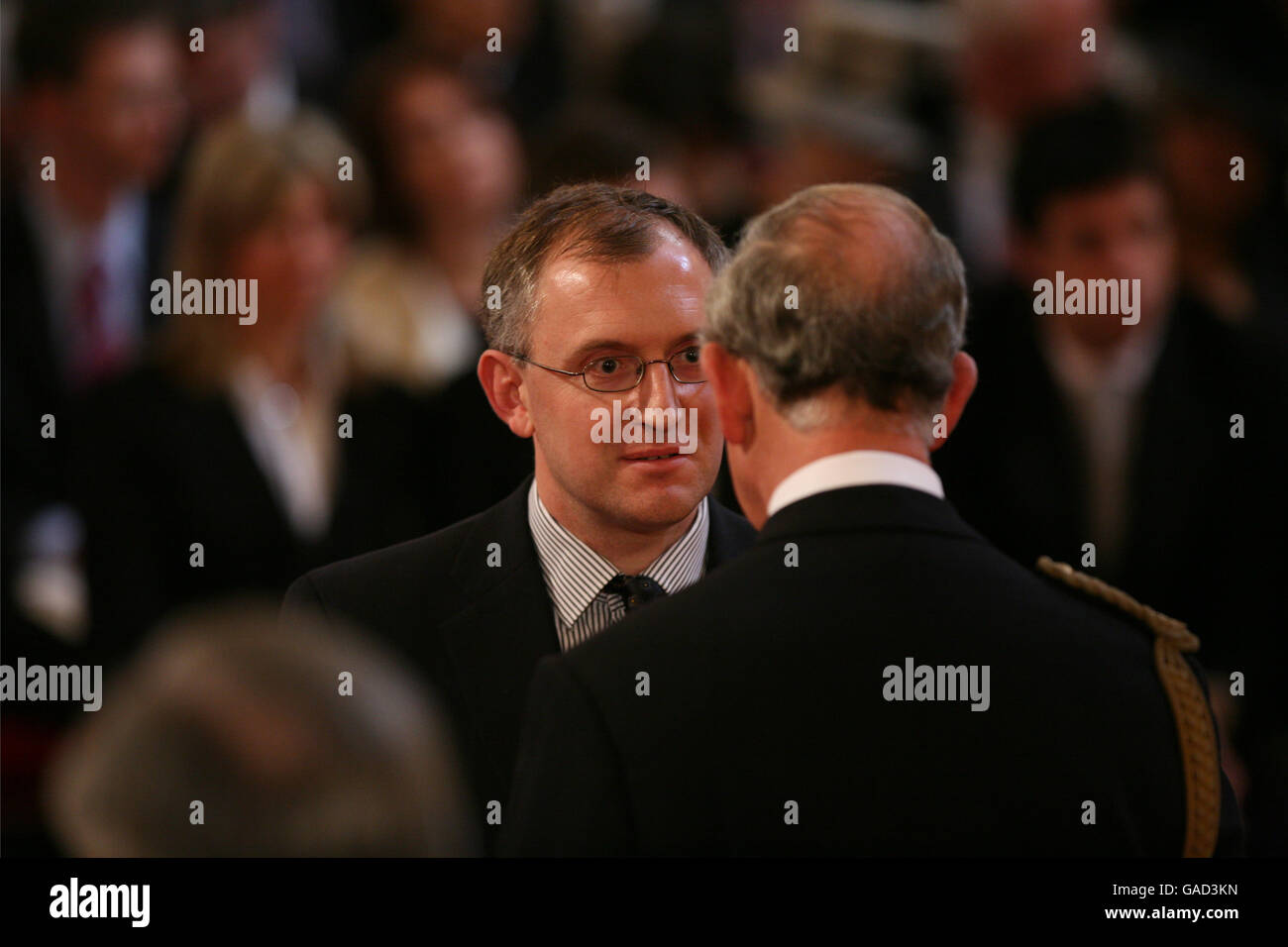 Commander Roy Hill is made an OBE by the Prince of Wales at Buckingham ...