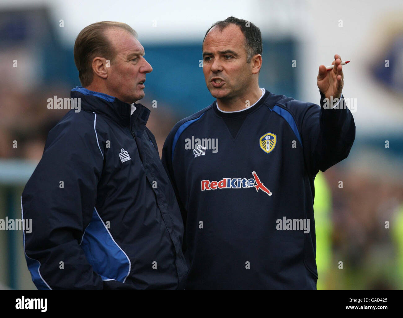 Leeds United's new assistant manager Dave Basset with a member of the ...