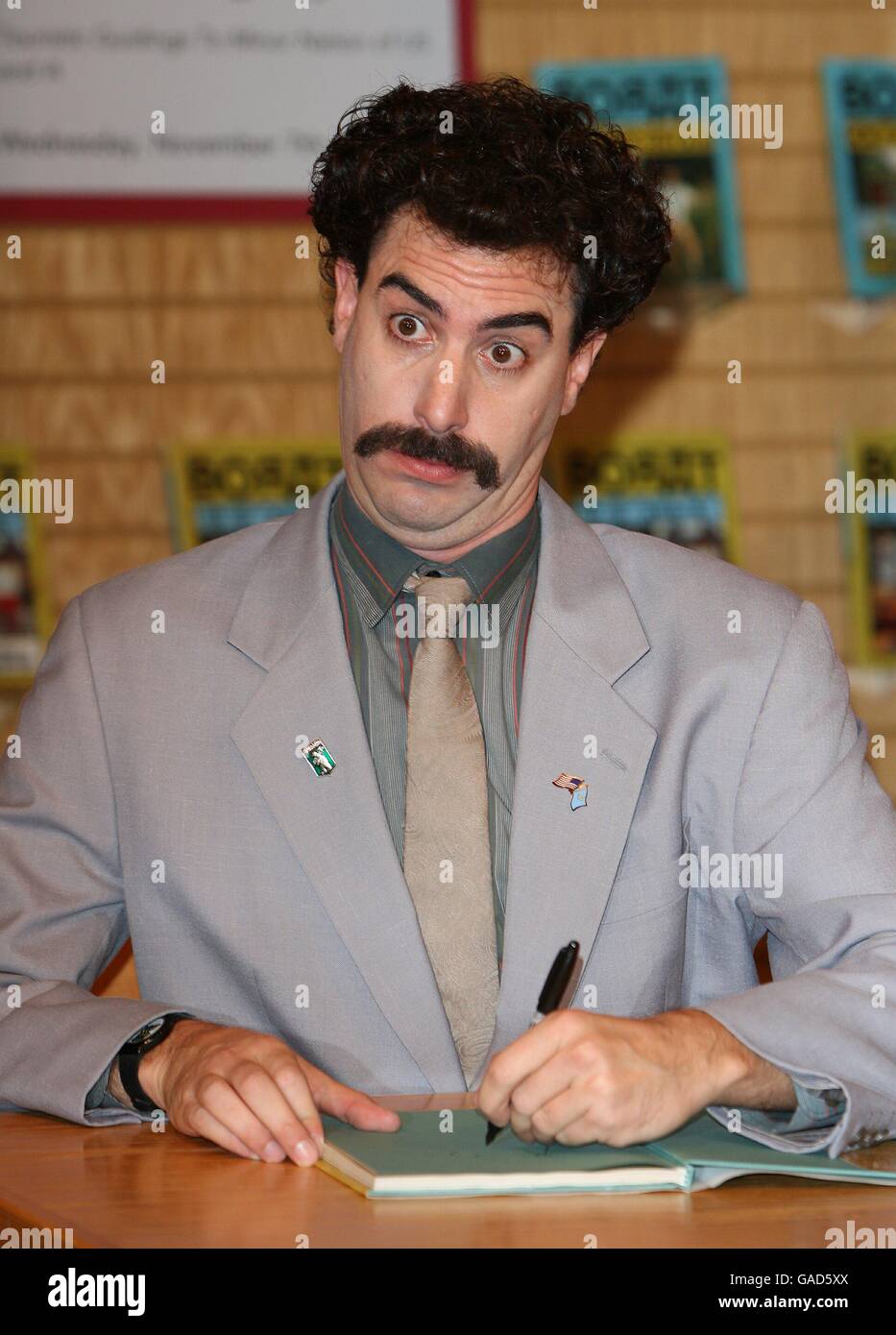 Borat signs copies of his new books Touristic Guidings to Minor Nation ...