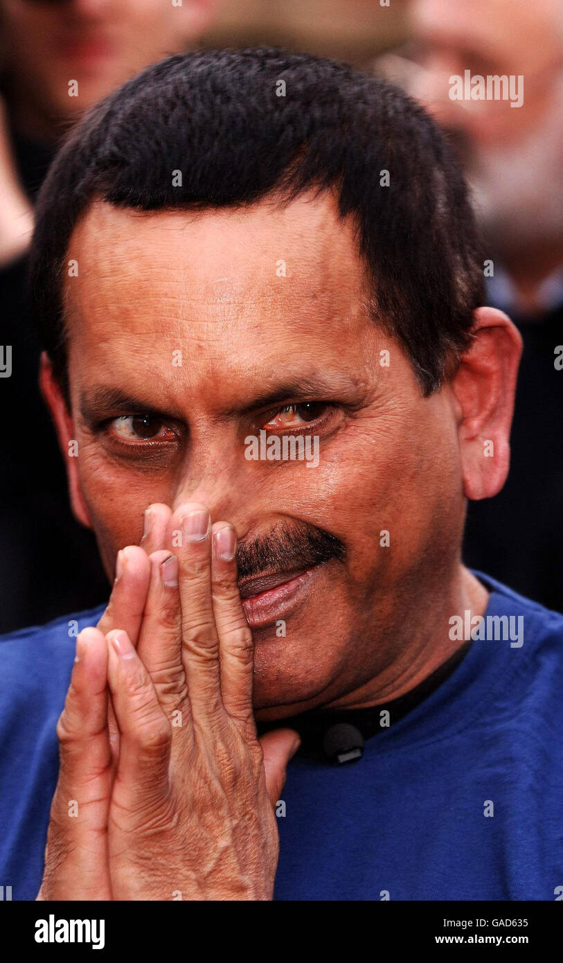 British strongman Manjit Singh after pulling a red London double-decker ...