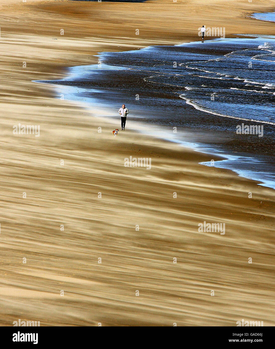 STANDALONE Photo. High winds hit the North of England today as a jogger ...