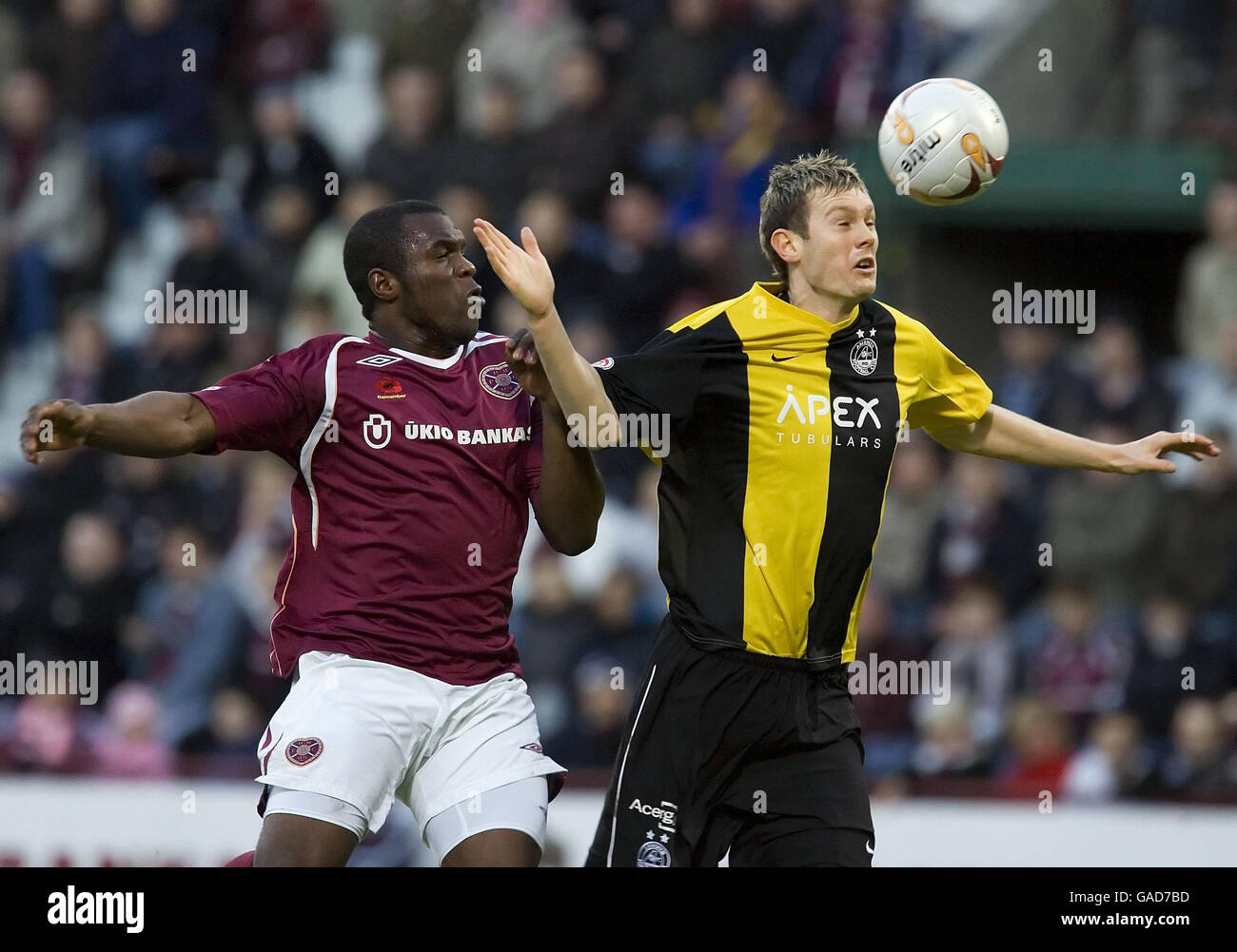 Hearts' Christian Nade (left) in action with Aberdeen's Zander Diamond ...
