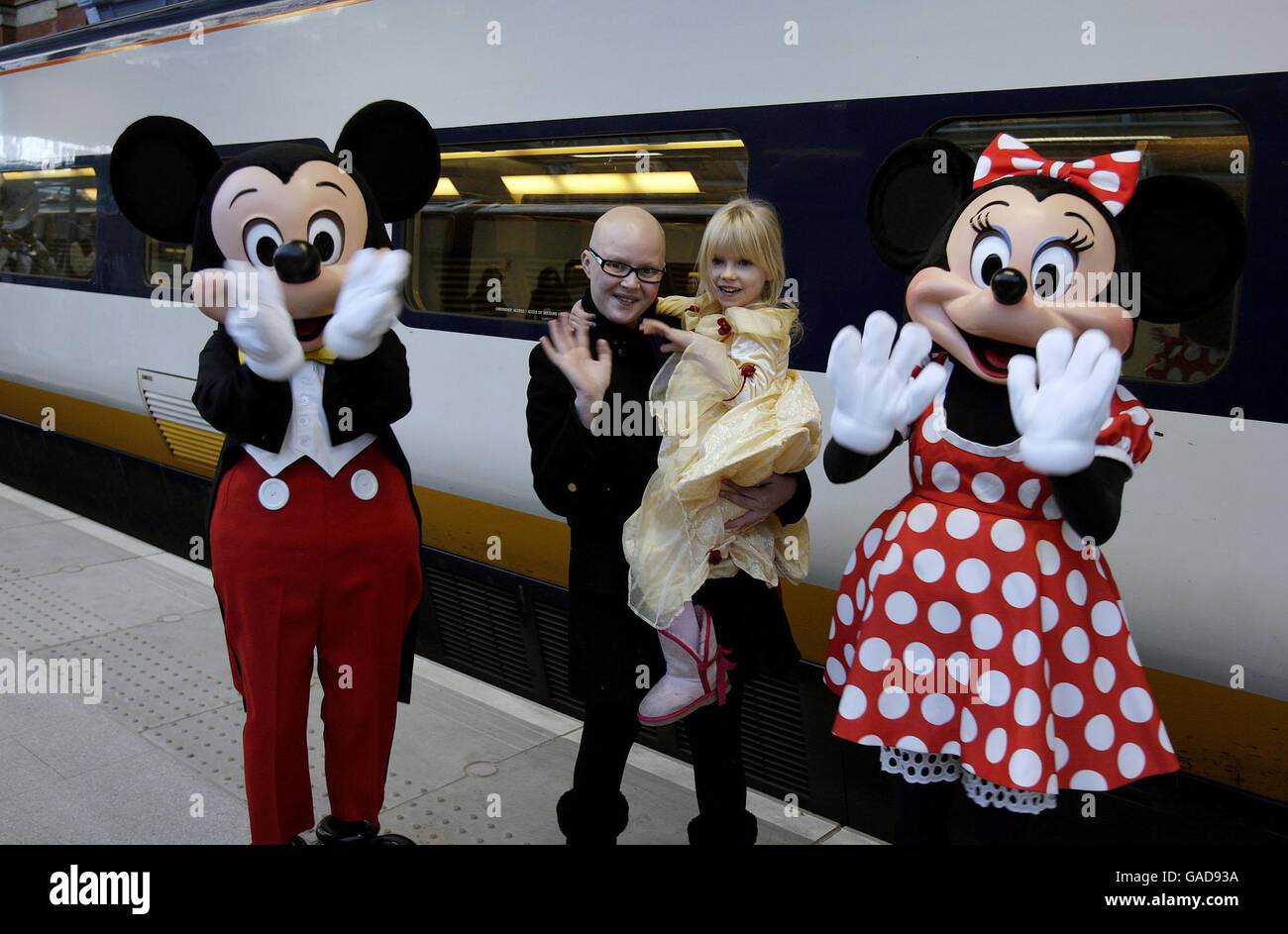 Gail Porter and her daughter Honey meet Mickey and Minnie Mouse as they ...
