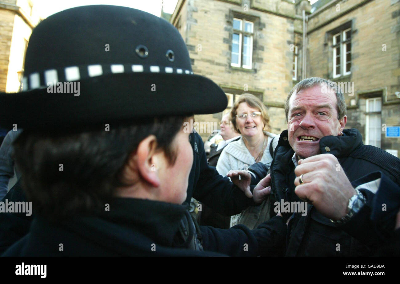 Vicky Hamilton's father Michael Hamilton (right) is restrained by ...