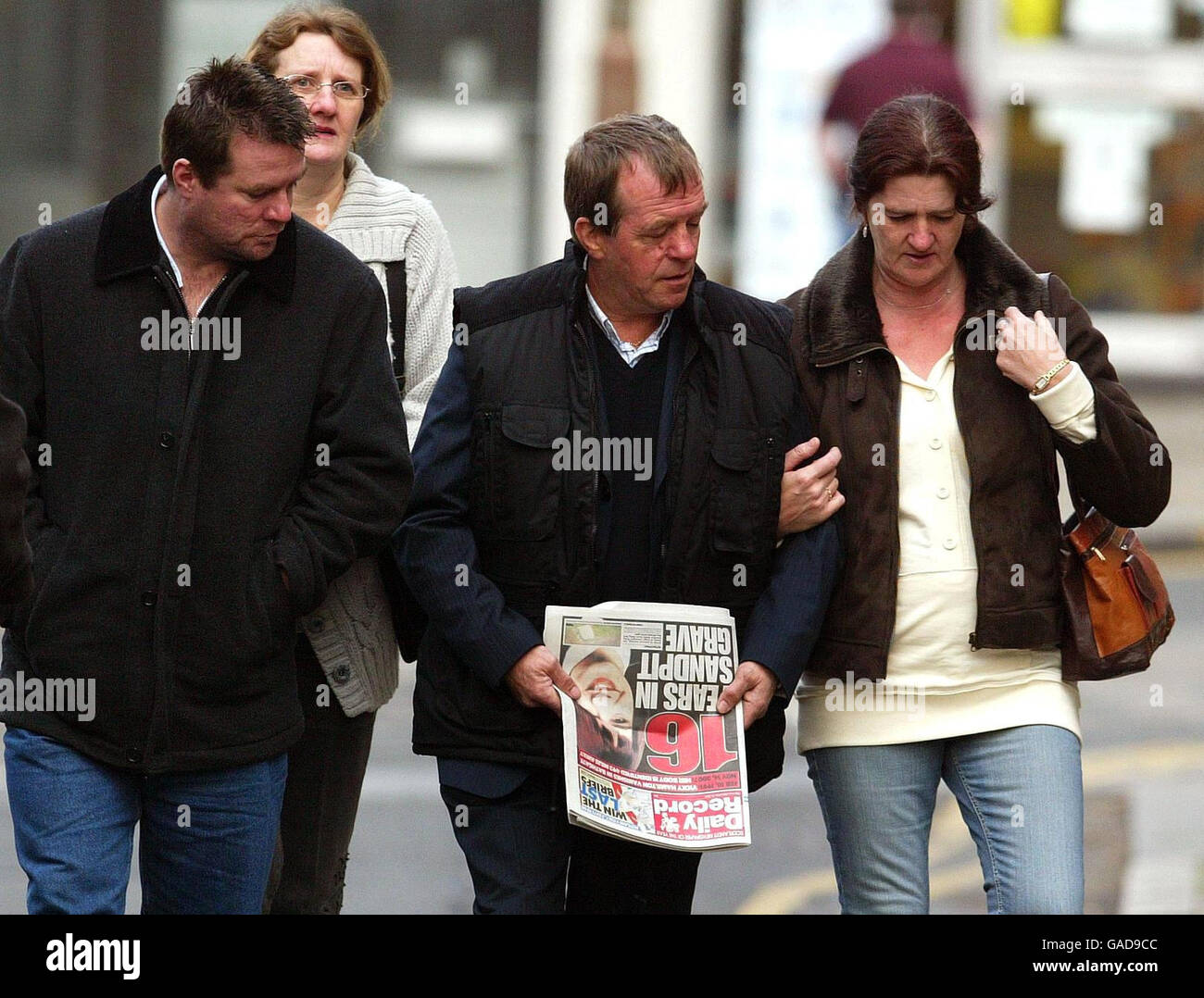 Vicky Hamilton's father Michael Hamilton (second from right) carries a ...
