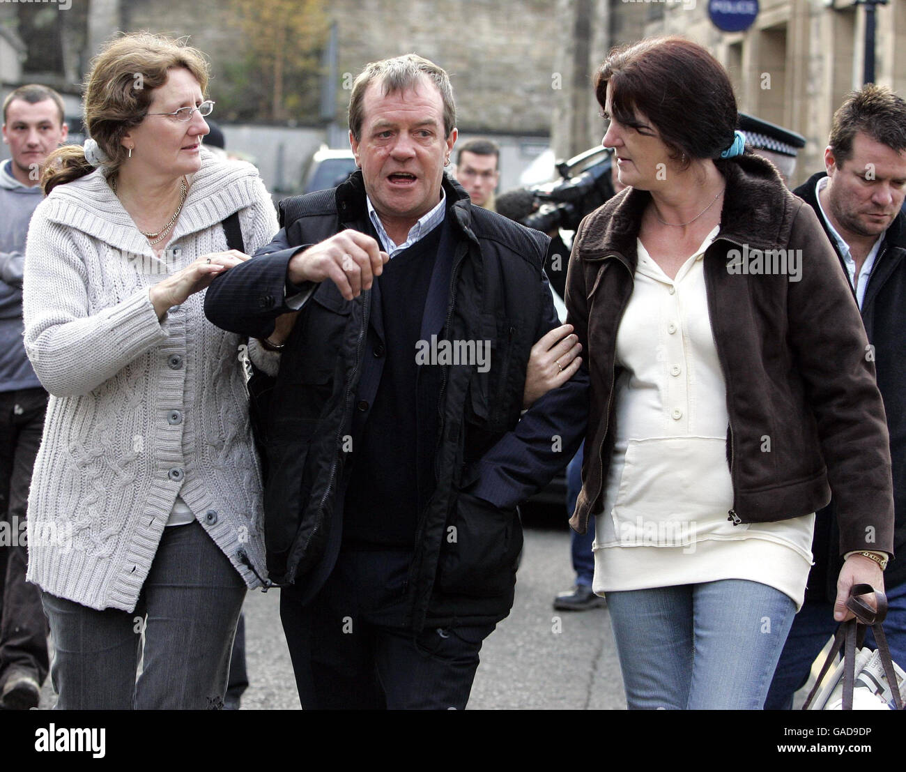 Vicky Hamilton's father Michael Hamilton (centre) walks with his wife ...
