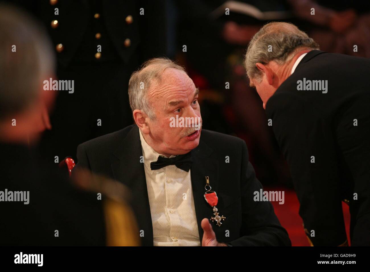 Mr. Alan Bell is made an MBE by The Prince of Wales at Buckingham ...