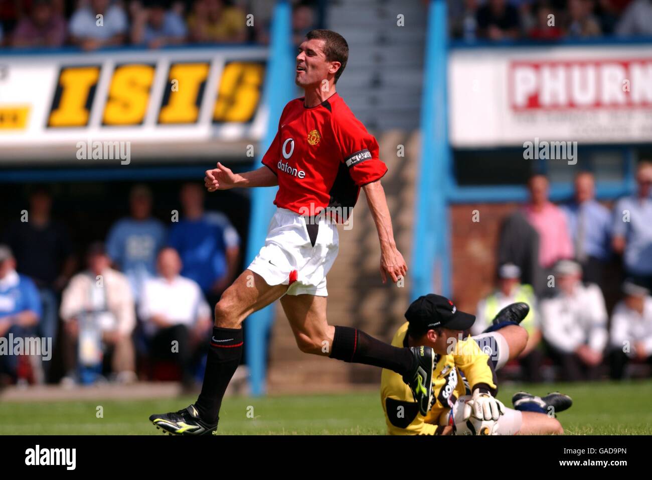 Chesterfield's goalkeeper Carl Muggleton saves at the feet of ...