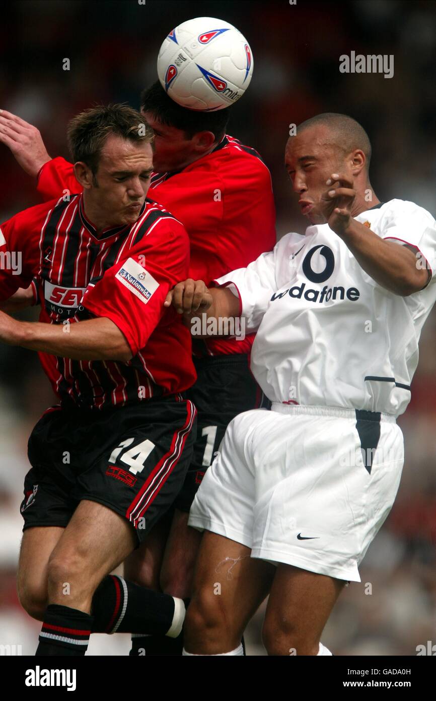 Manchester United's Mikael Silvestre jumps with Bournemouth's James ...