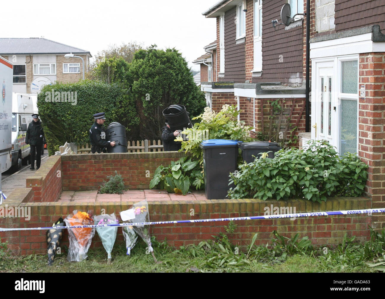 Dig goes on at house after body discovery Stock Photo - Alamy