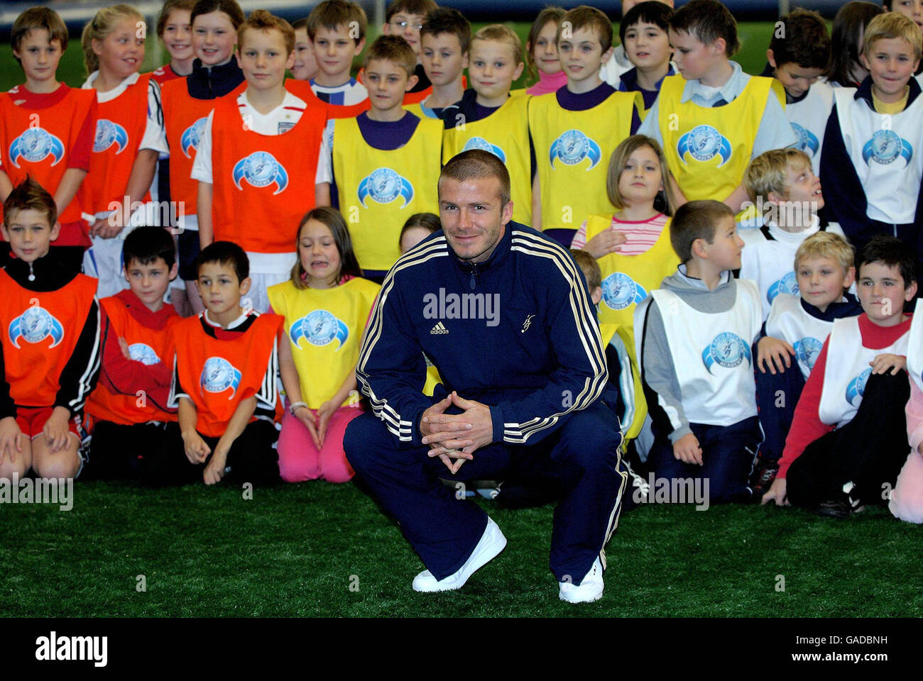 David Beckham poses with children during a photocall to mark the second ...