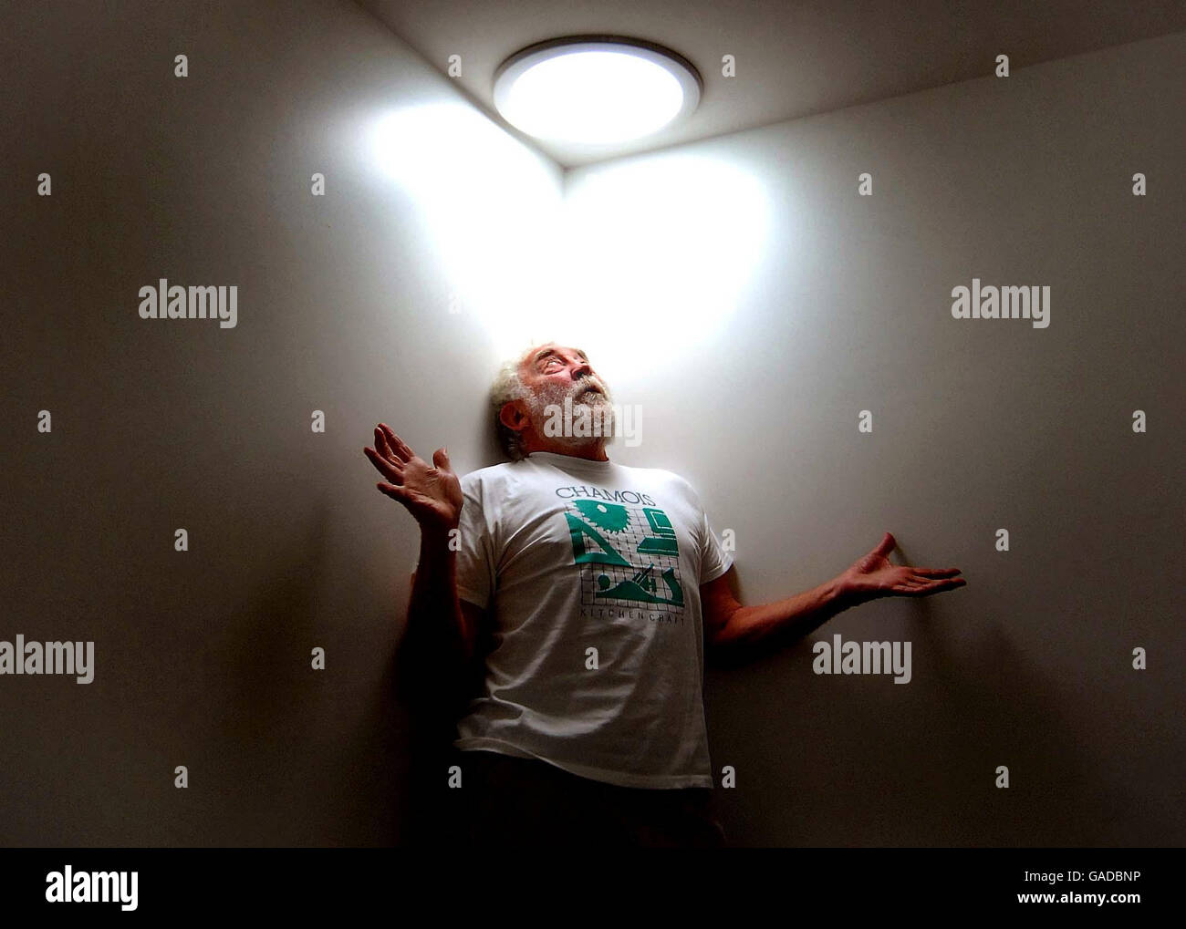 Conservationist David Bellamy looks up at monodraught sunpipe in a ...