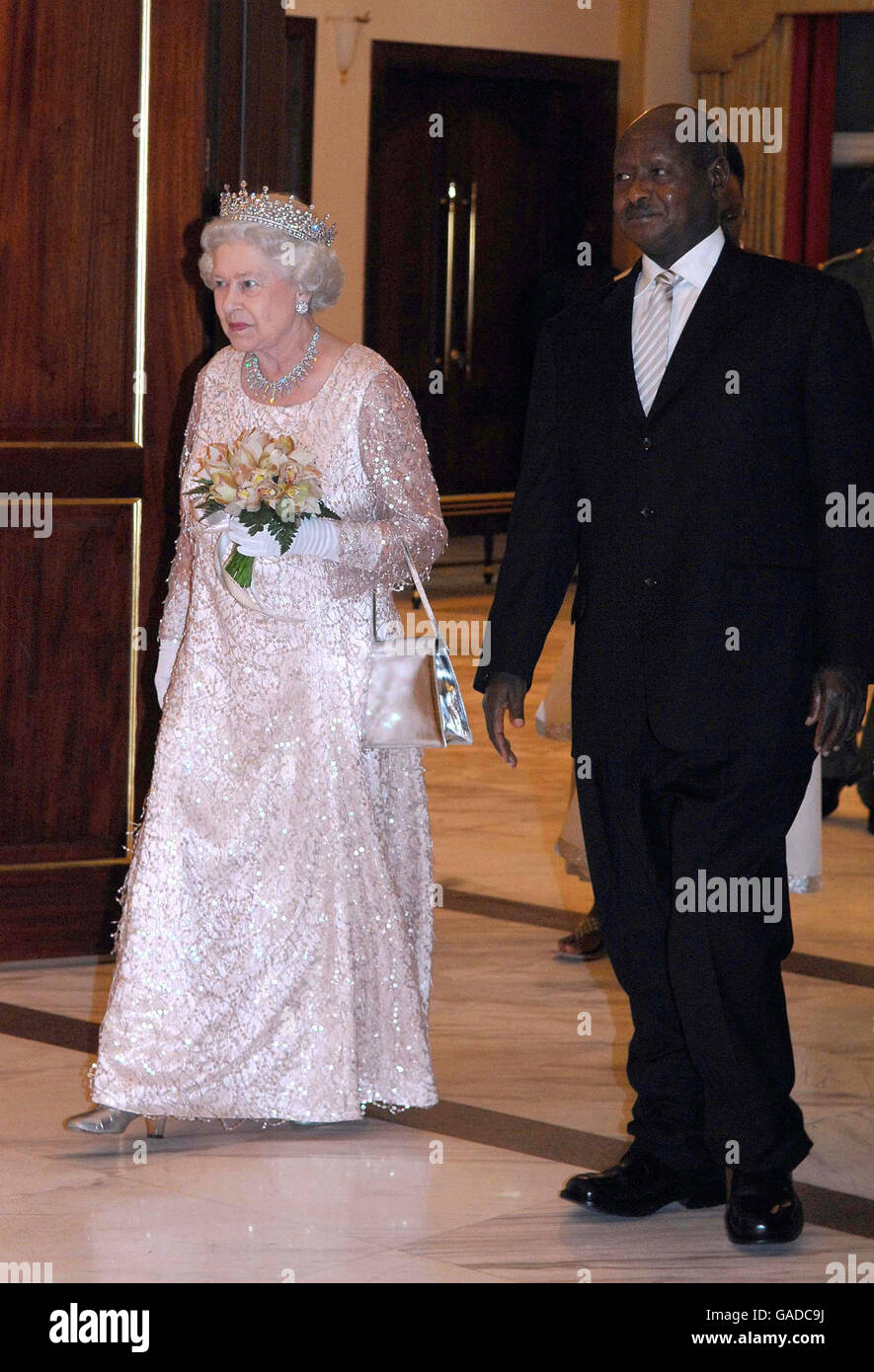 Britain's Queen Elizabeth II and the Ugandan President Yoweri Kaguta ...