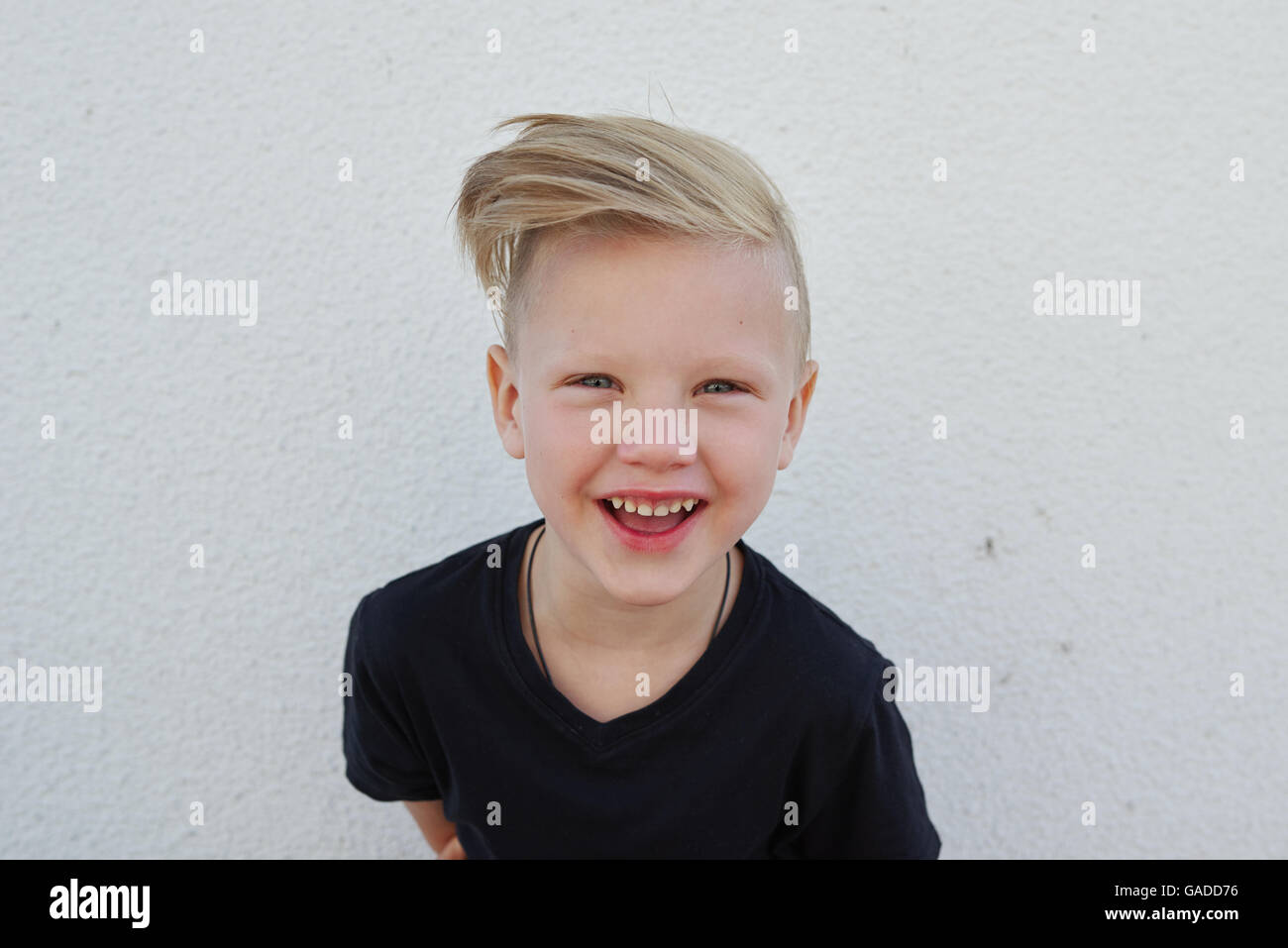 young emotional boy on bright background Stock Photo - Alamy