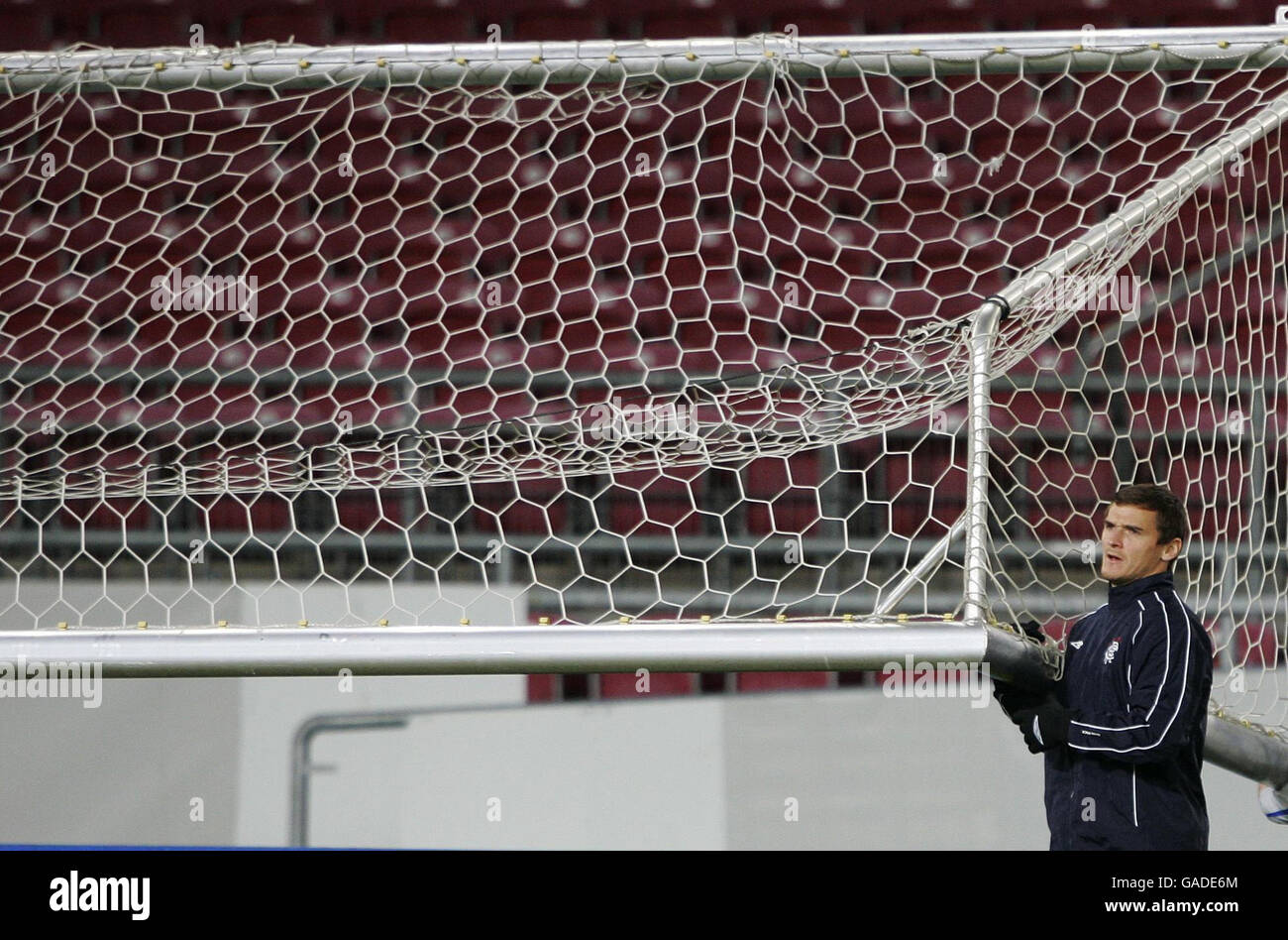 Rangers player Lee McCulloch lifts the goalposts during a training ...
