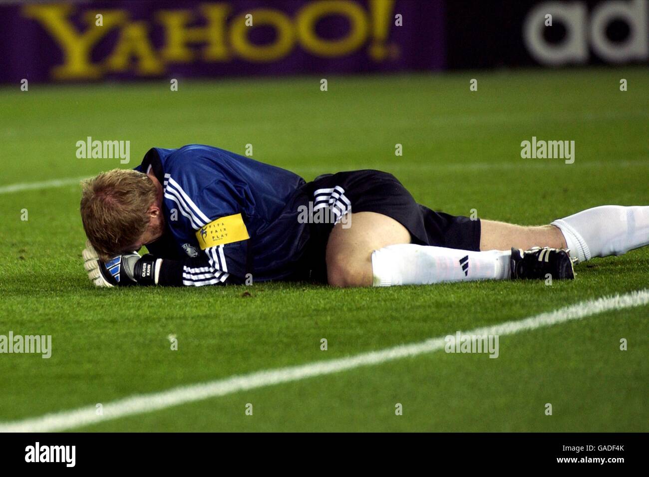 Germany goalkeeper Oliver Kahn lies in his goalmouth after making the ...