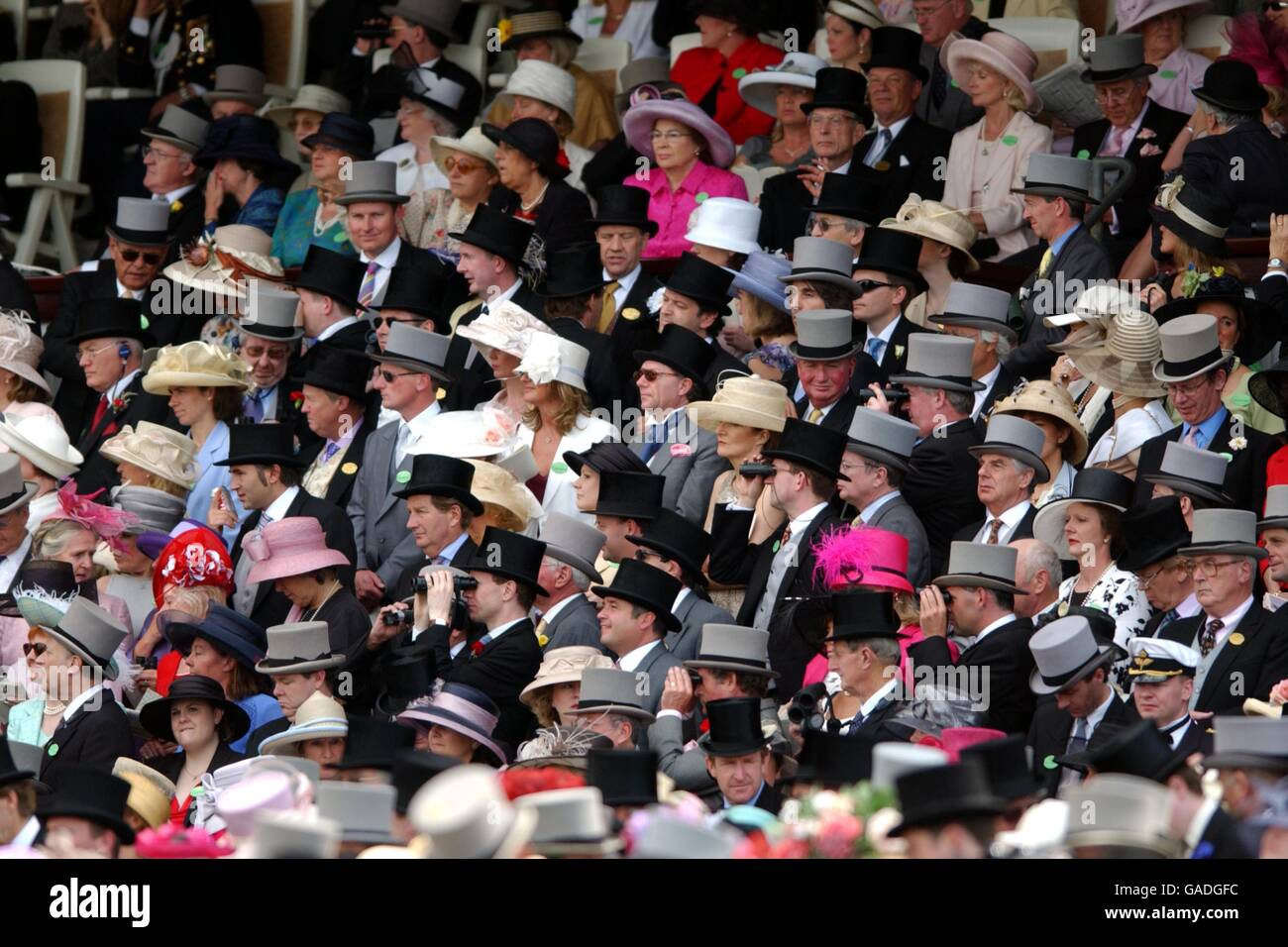 Racegoers wearing the traditional top hats enjoy their day at royal ...