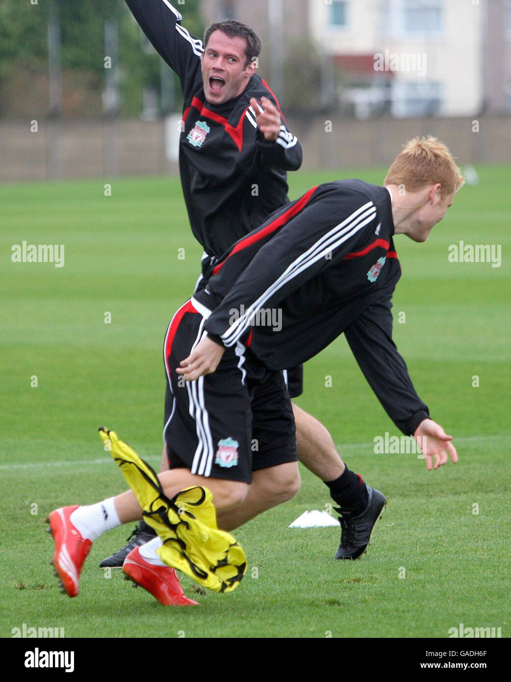Liverpool's Jamie Carragher (left) and John Arne Risse during a ...