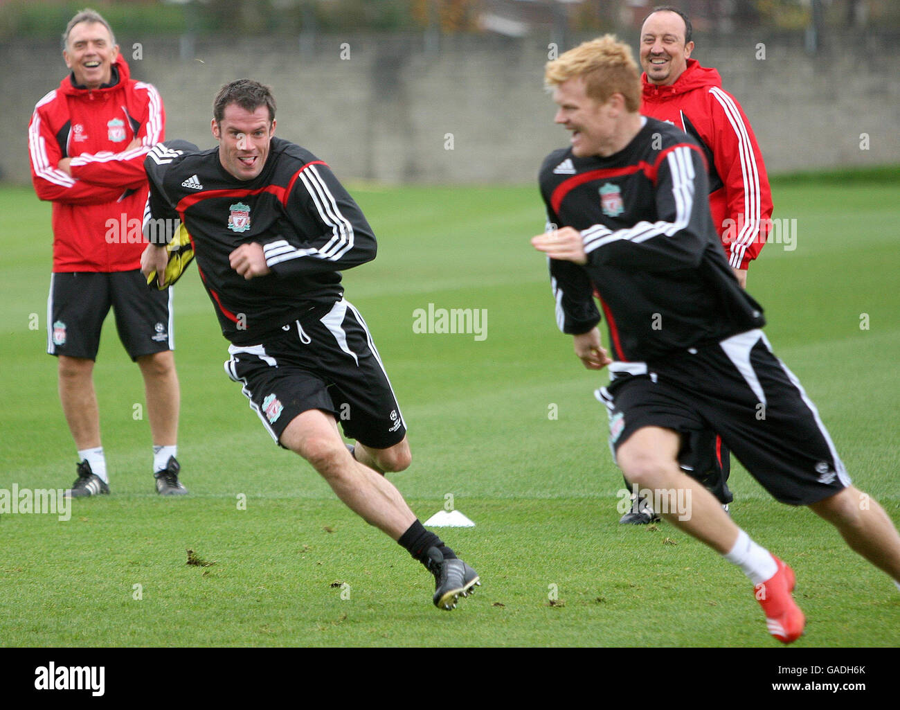 Liverpool's John Arne Risse (right) is chased by Jamie Carragher during ...