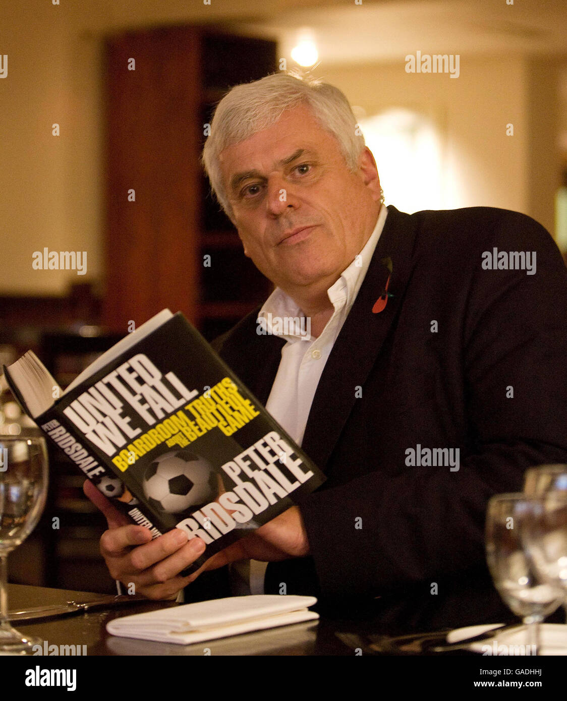 Peter Ridsdale poses for a photograph with his new book 'United We Fall ...