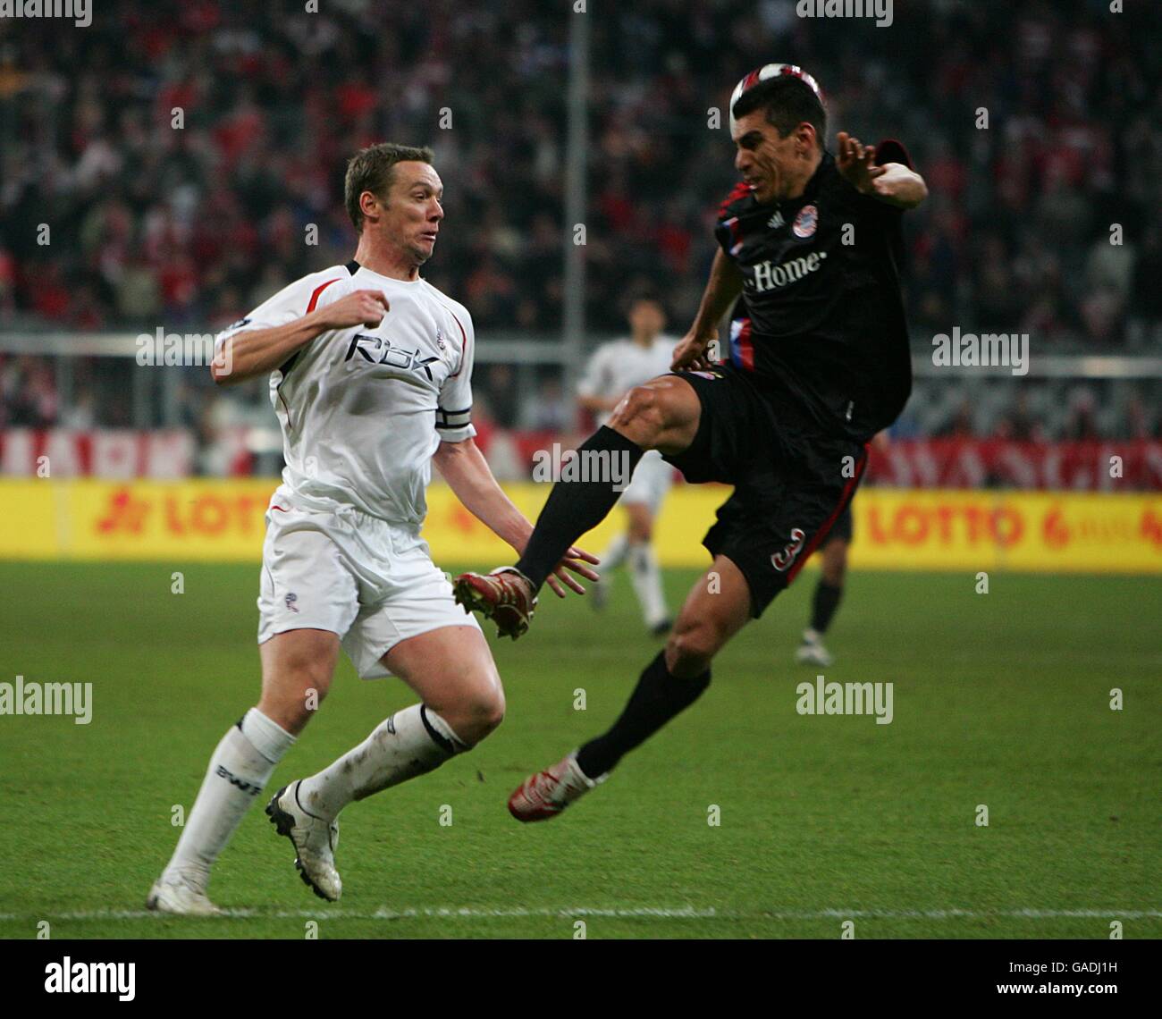 Bolton Wanderers' Kevin Nolan beats Bayern Munich's Ferreira Lucio to ...