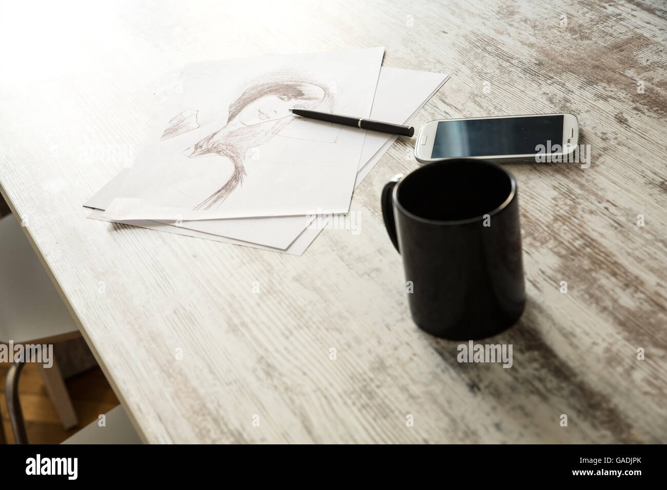 Drawing a sketch on the Table Stock Photo - Alamy
