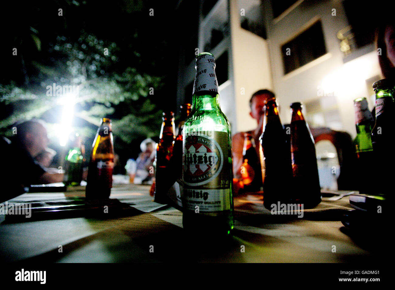 Beer bottles sit on a table in rwanda hi-res stock photography and ...