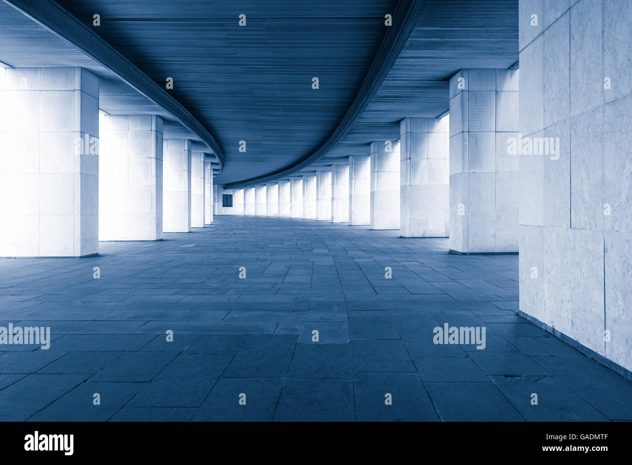 Long wide corridor of the building with columns Stock Photo - Alamy