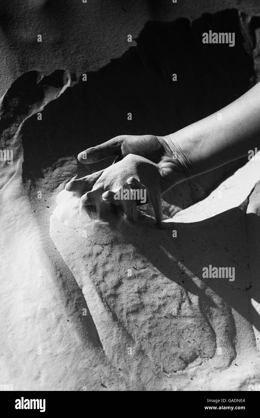 Fingers through sand Black and White Stock Photos & Images - Alamy