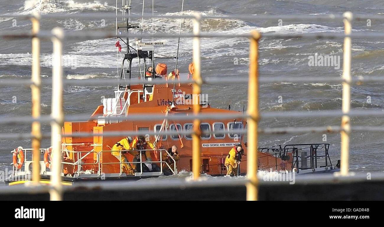 Whitby Lifeboat crew return after rescuing the crew of a small boat ...