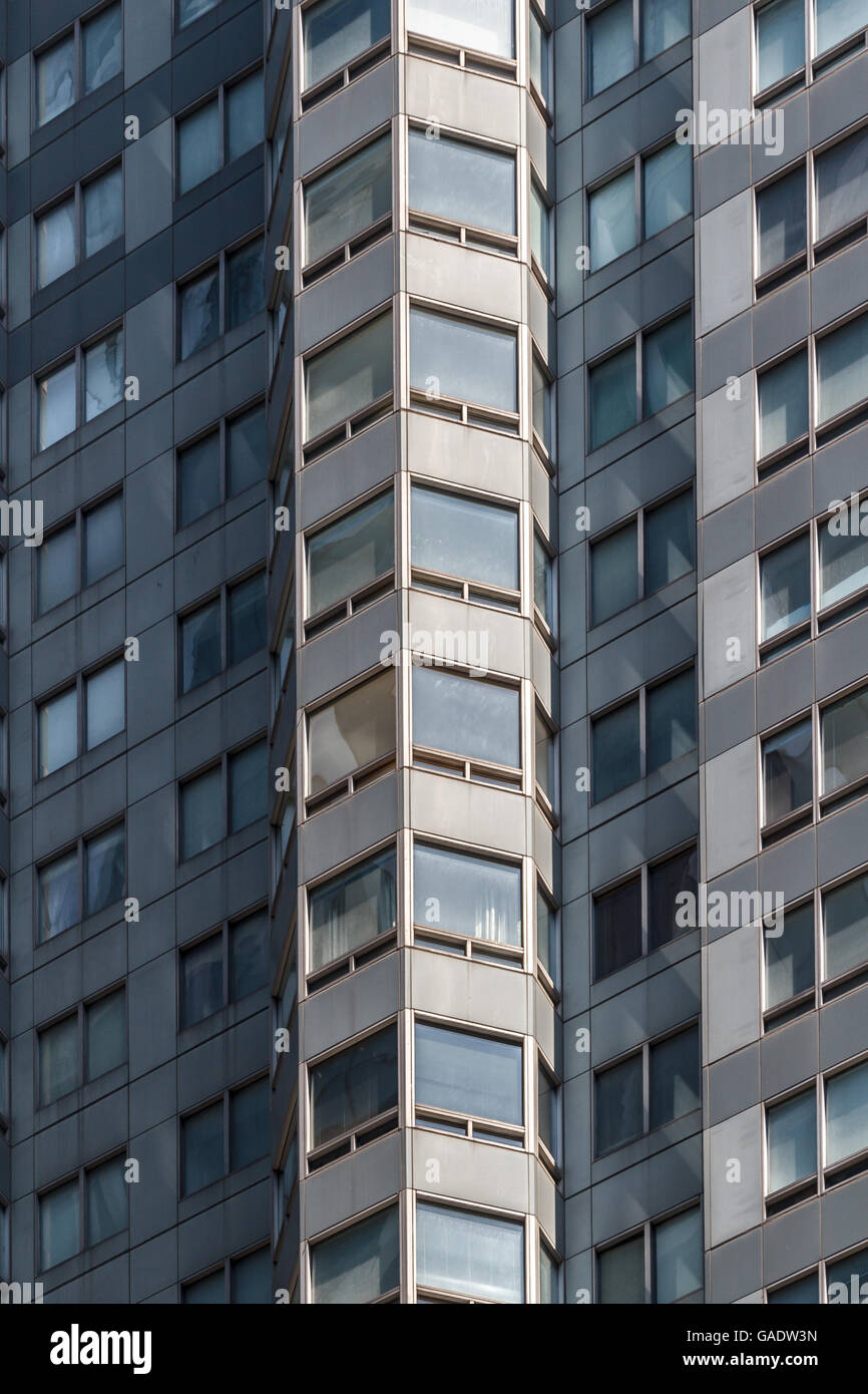 The windows of a highrise building creating a pattern of shapes and ...