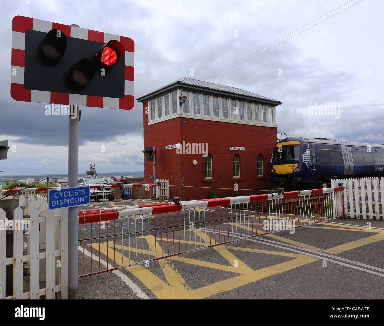 Scotrail train passing level crossing Carnoustie Angus Scotland July ...