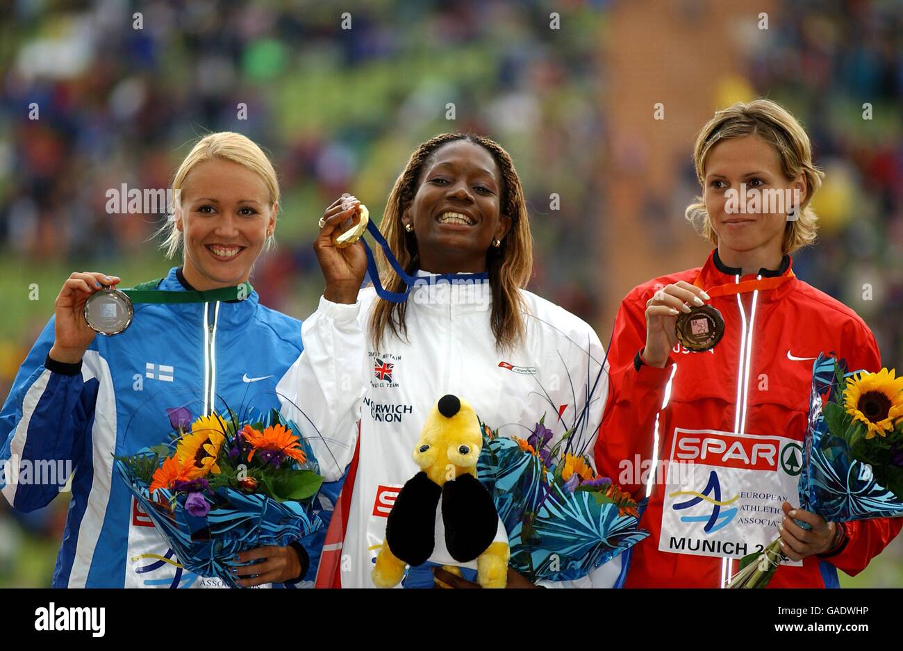 Great Britain's gold medalist Ashia Hansen celebrates with Finland's ...