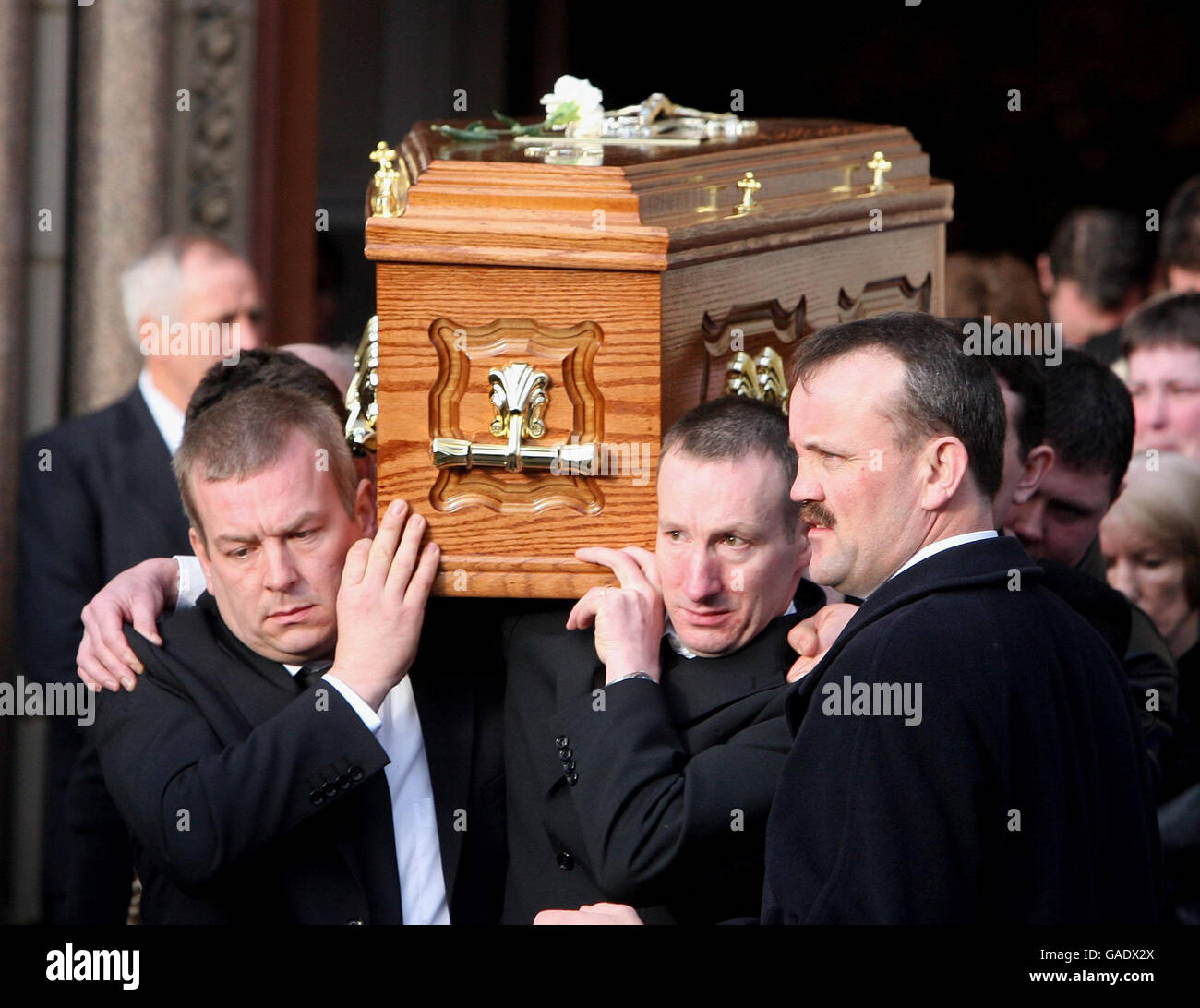 The coffin of Arthur McElhill is removed for burial after requiem mass ...
