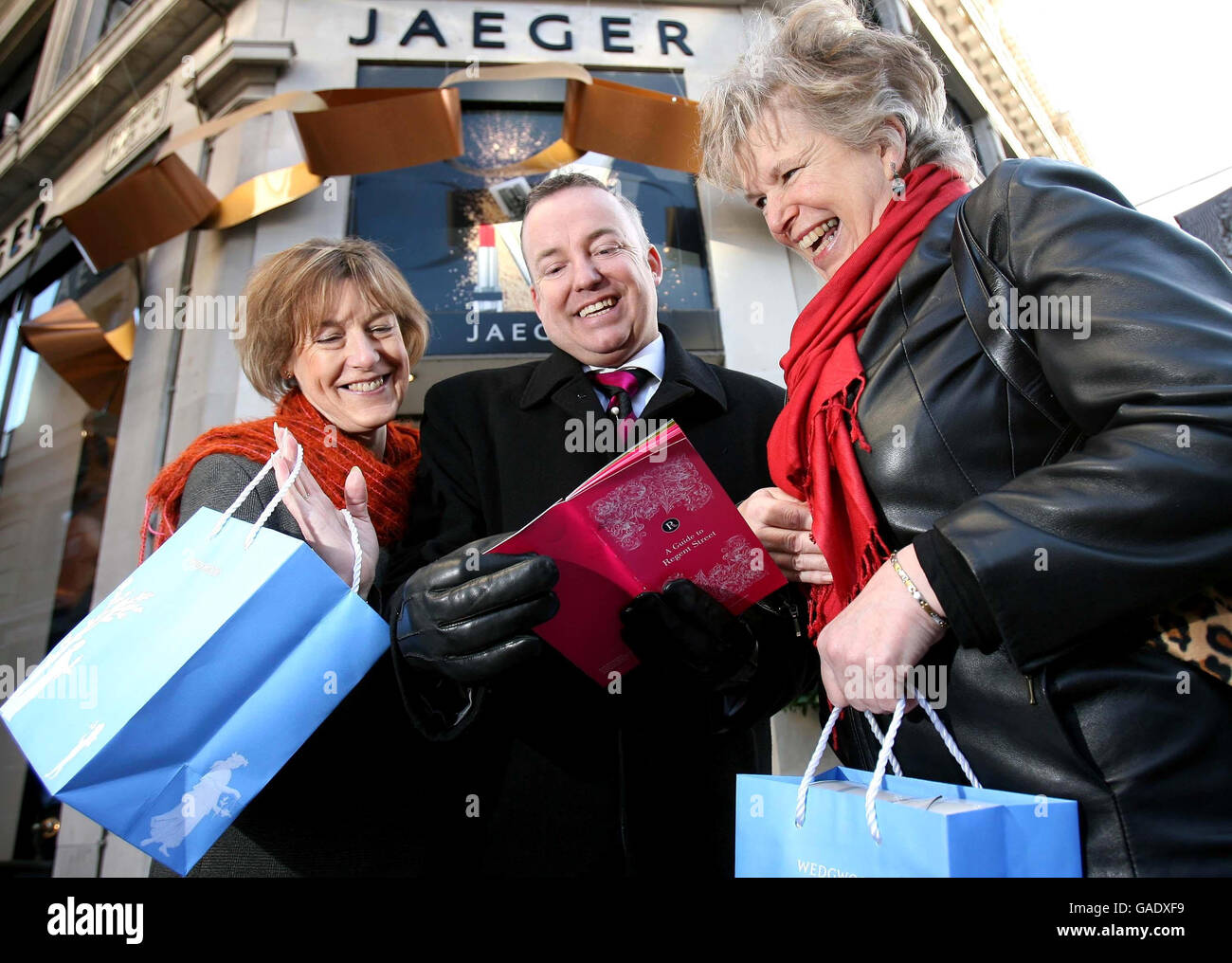 Regent Street Butler Tony Sutton helps June Knowles (left) and Kay ...