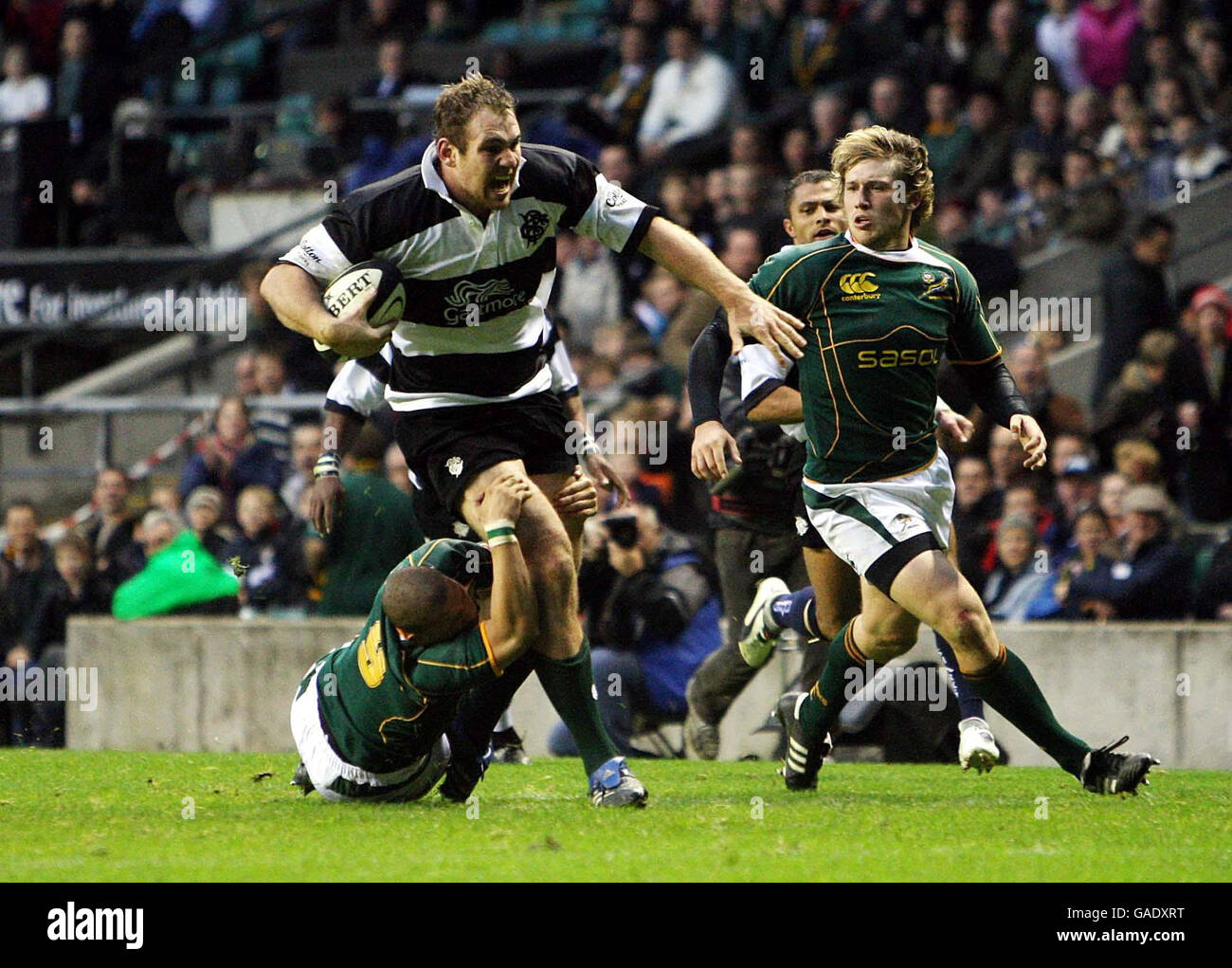 Barbarians' Rocky Elsom breaks through the tackle of South Africa's ...