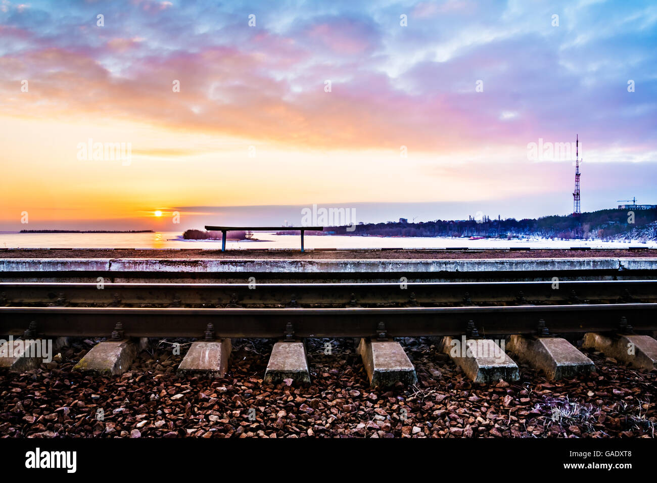 Railroad track during autumn morning near river Stock Photo - Alamy
