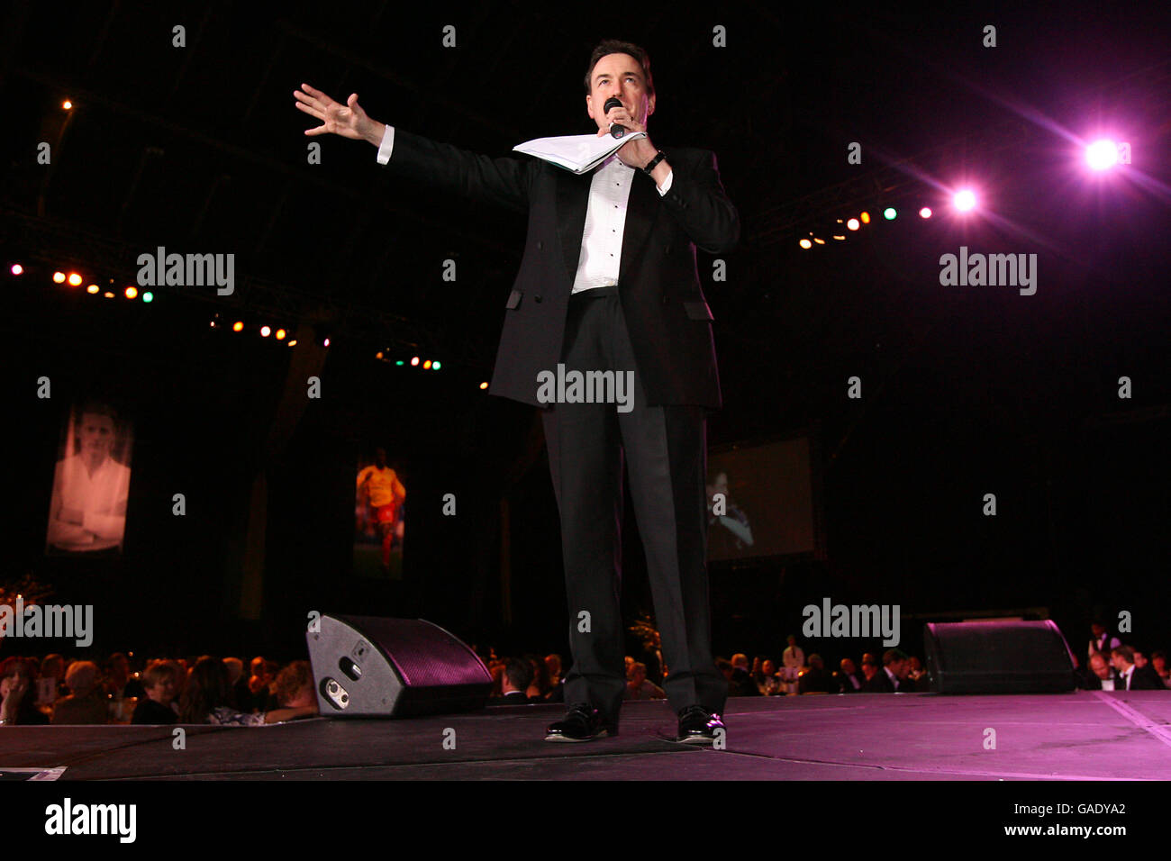 The auctioneer at the pfa centenary gala dinner hi-res stock ...