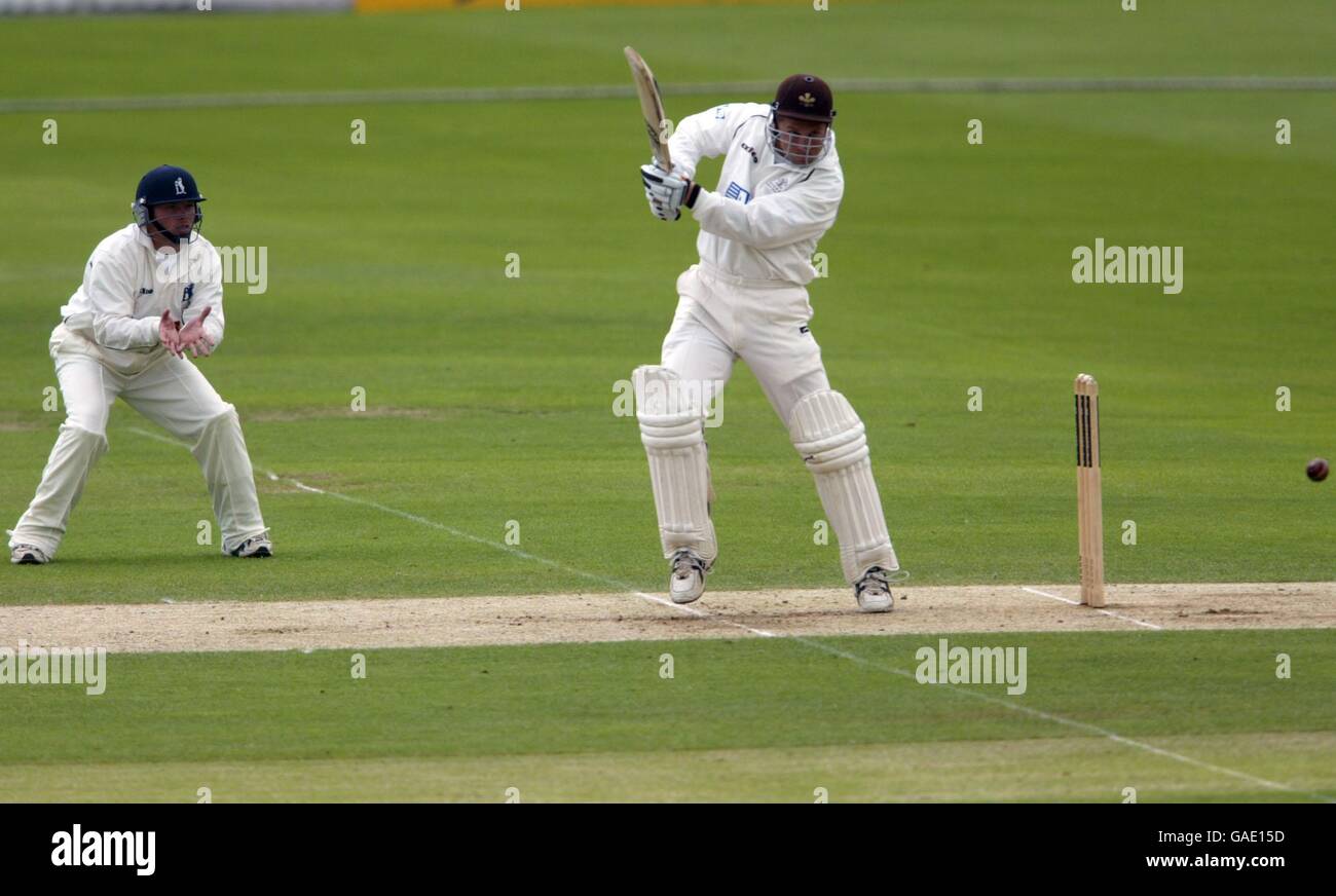 Surreys jonathan batty hits out towards the boundary hi-res stock ...