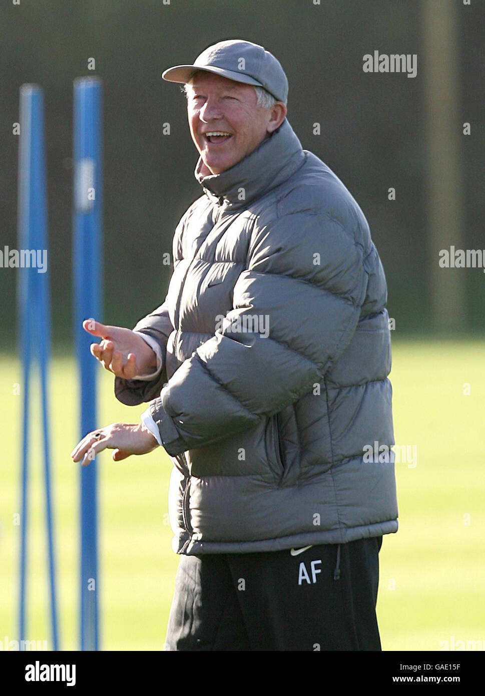 Manchester United manager Alex Ferguson smiles during a training ...