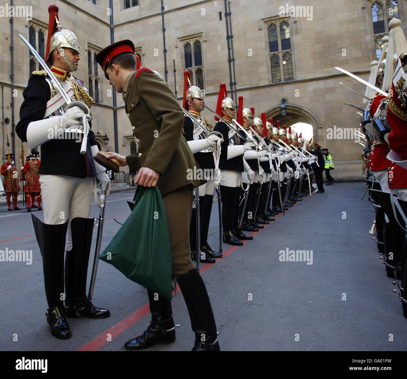 A Household Cavalryman's uniform gets a final brush while getting ready ...