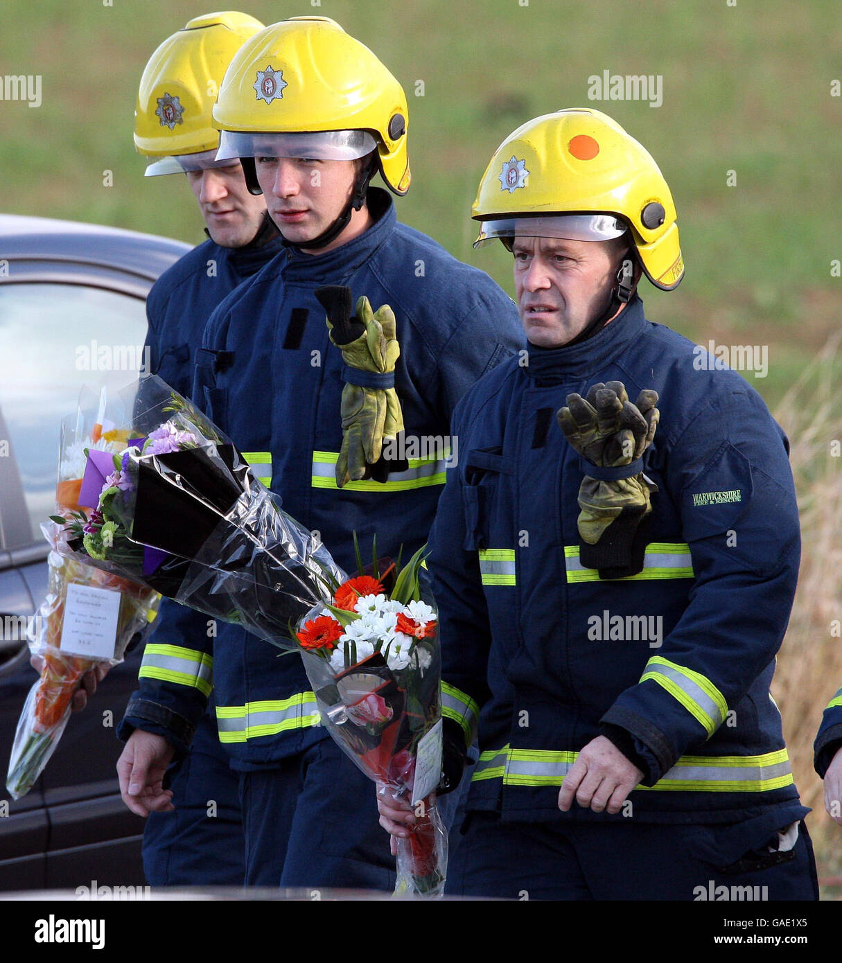 Firefighters arrive with tributes for their colleagues who died ...