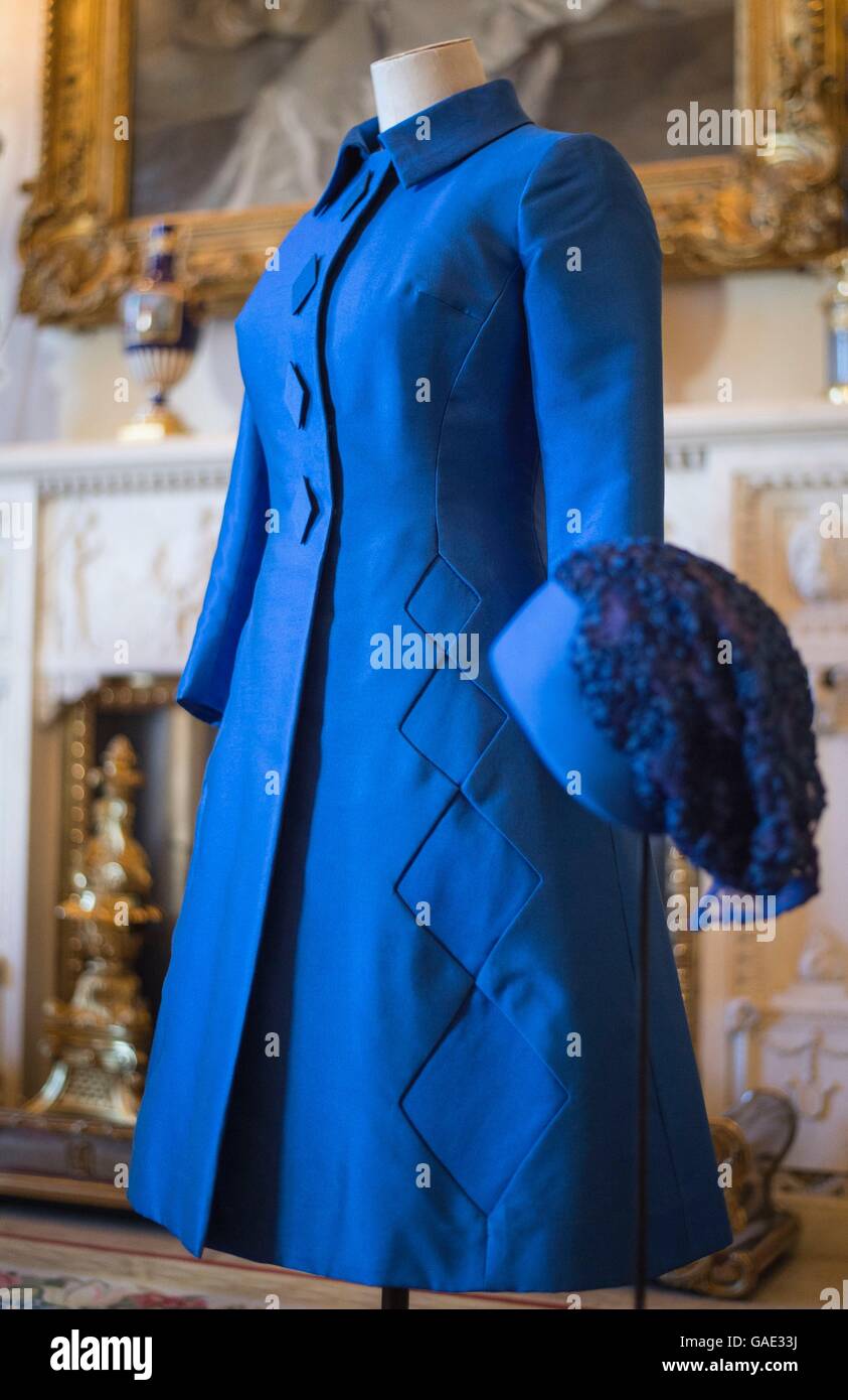 An outfit and hat designed by Sir Norman Hartnell, worn by The Queen to ...