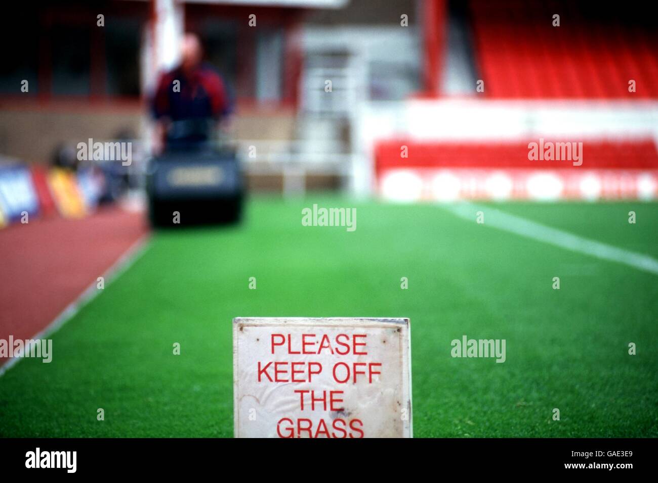 Sign groundsman mowing rolling grass football robboedit1 hi-res stock ...