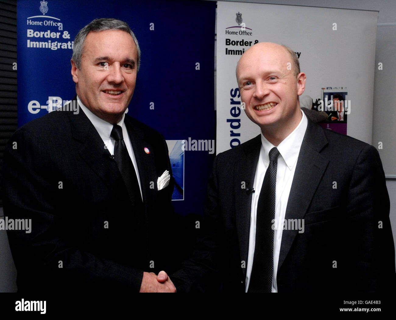 Chief Executive Officer of Raytheon Company Bill Swanson (left) and ...