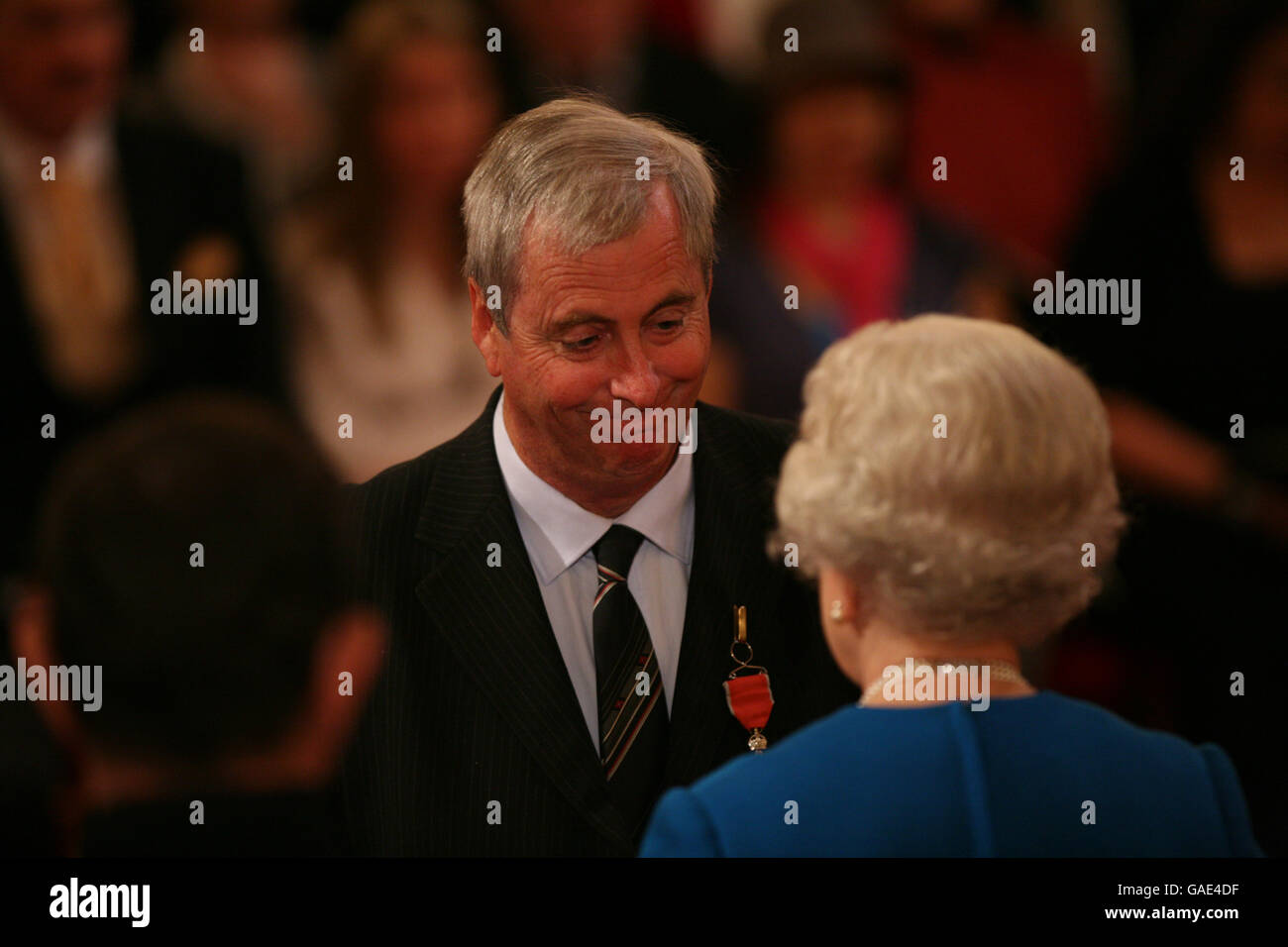 Mr. John Allen from Exeter is made an MBE by The Queen at Buckingham ...