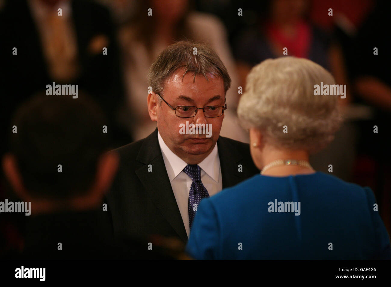 Mr. James Coyle from Glasgow is made an MBE by The Queen at Buckingham ...